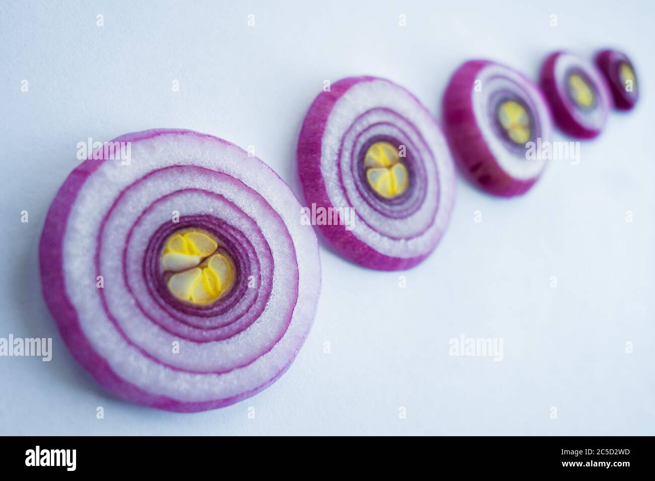 Round slices of red onion isolated on a white background, side view ...