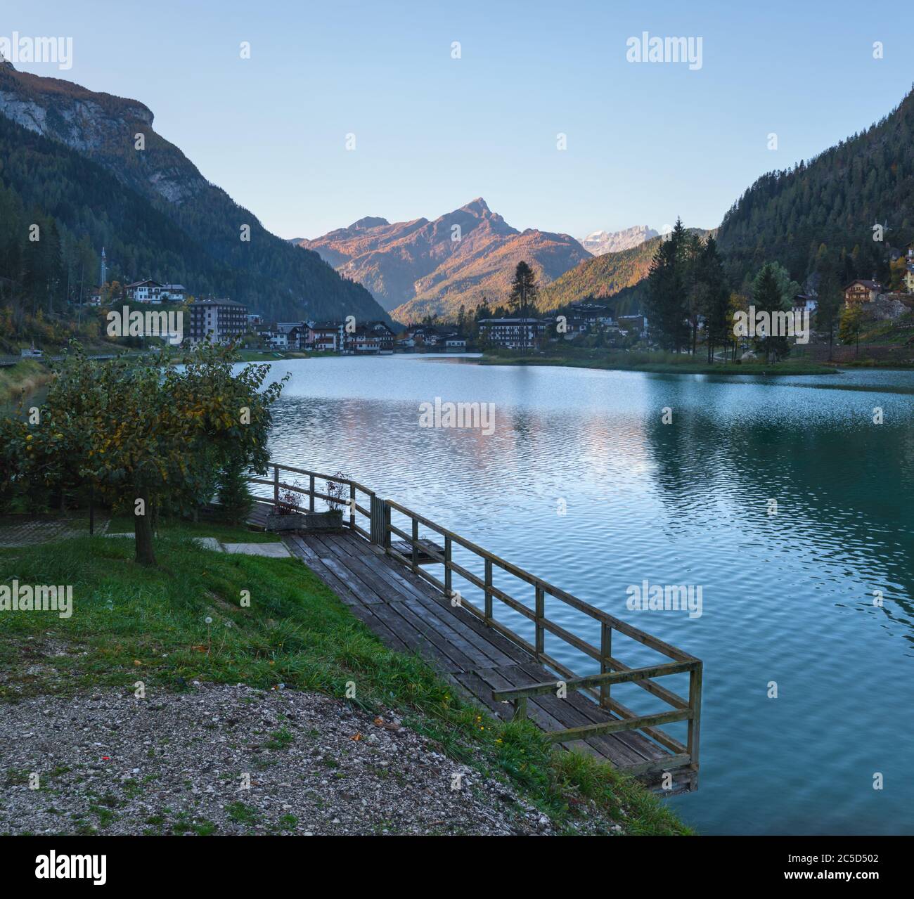Autumn morning alpine Dolomites mountain lake Alleghe, Belluno ...