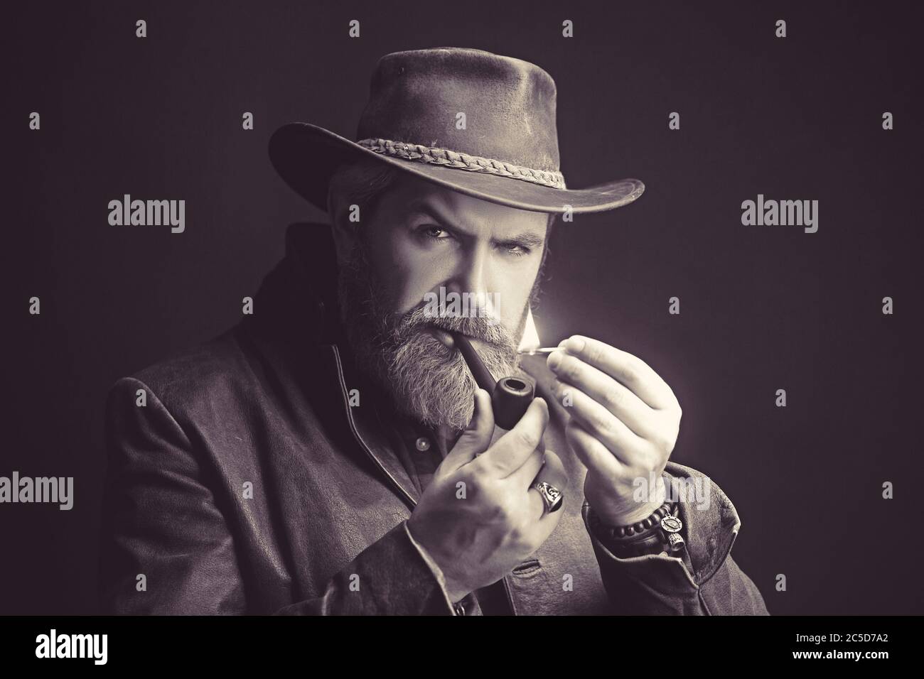 Cowboy smoking a pipe hi-res stock photography and images - Alamy