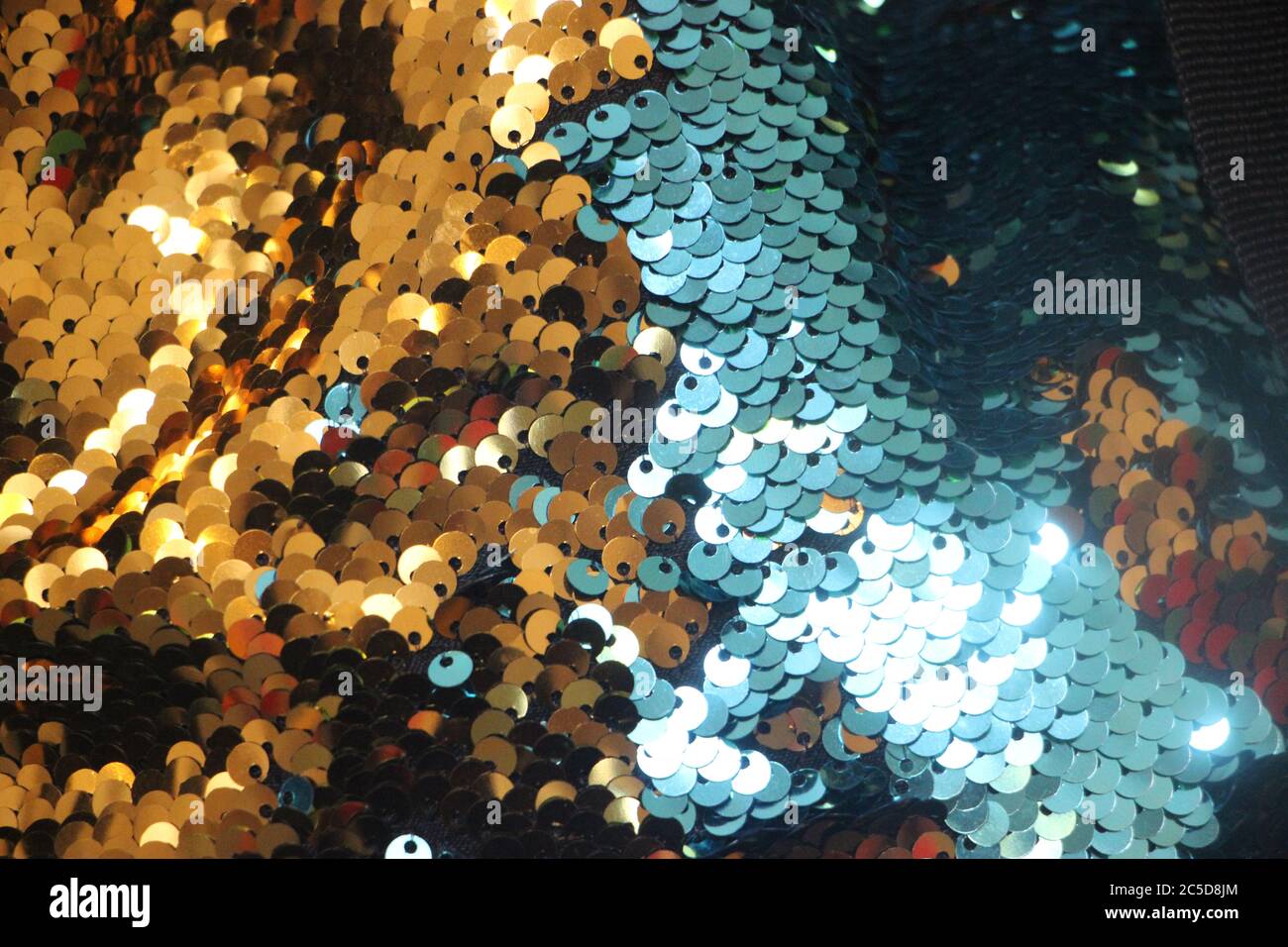 Multicolored shiny sequins. Fabric with sequins as a background ...