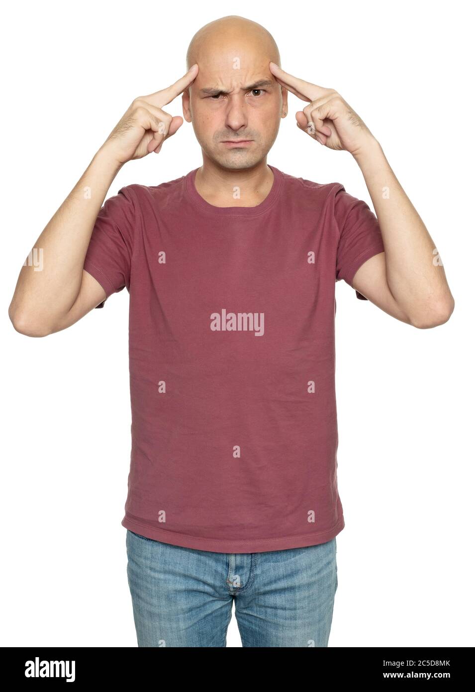 Serious bald man trying to remember something. Isolated on white studio ...