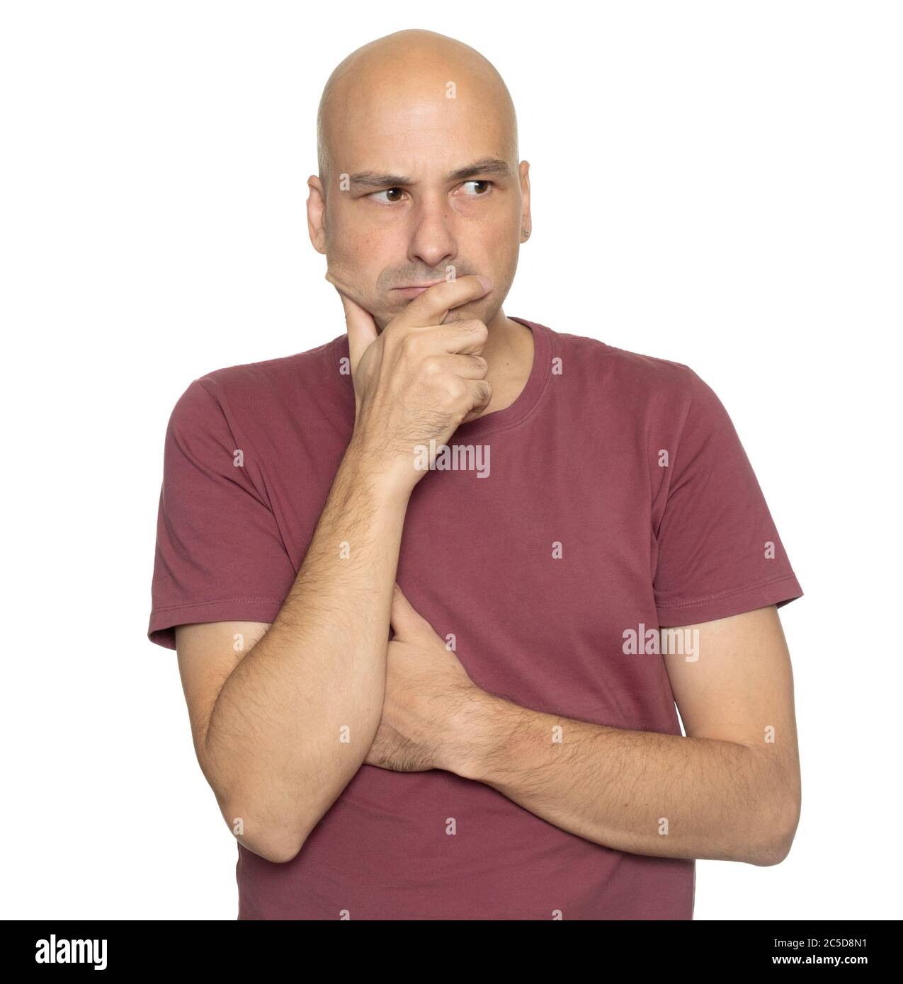 Serious bald man thinking looking aside isolated on white background ...