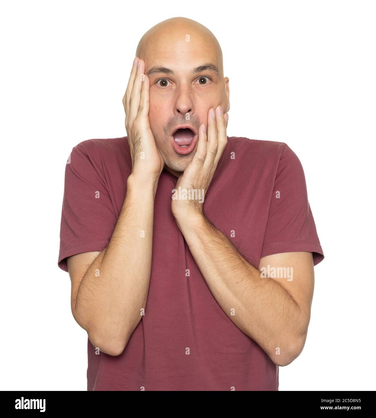 Shocked 40 years bald man holds his head in hands. Isolated on white ...