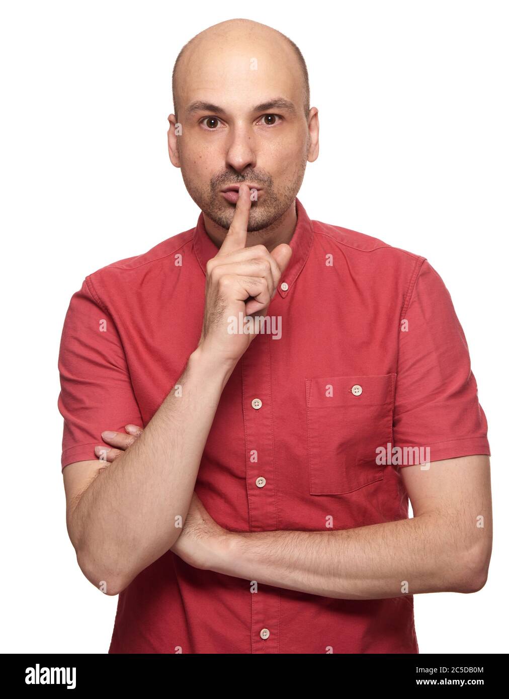 Middle aged bald man making shh gesture. Isolated on white background ...
