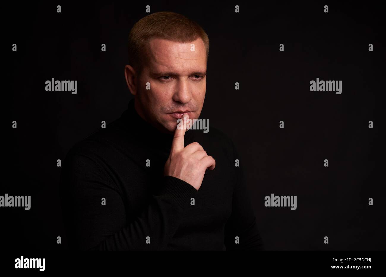 Serious man thinking hi-res stock photography and images - Alamy