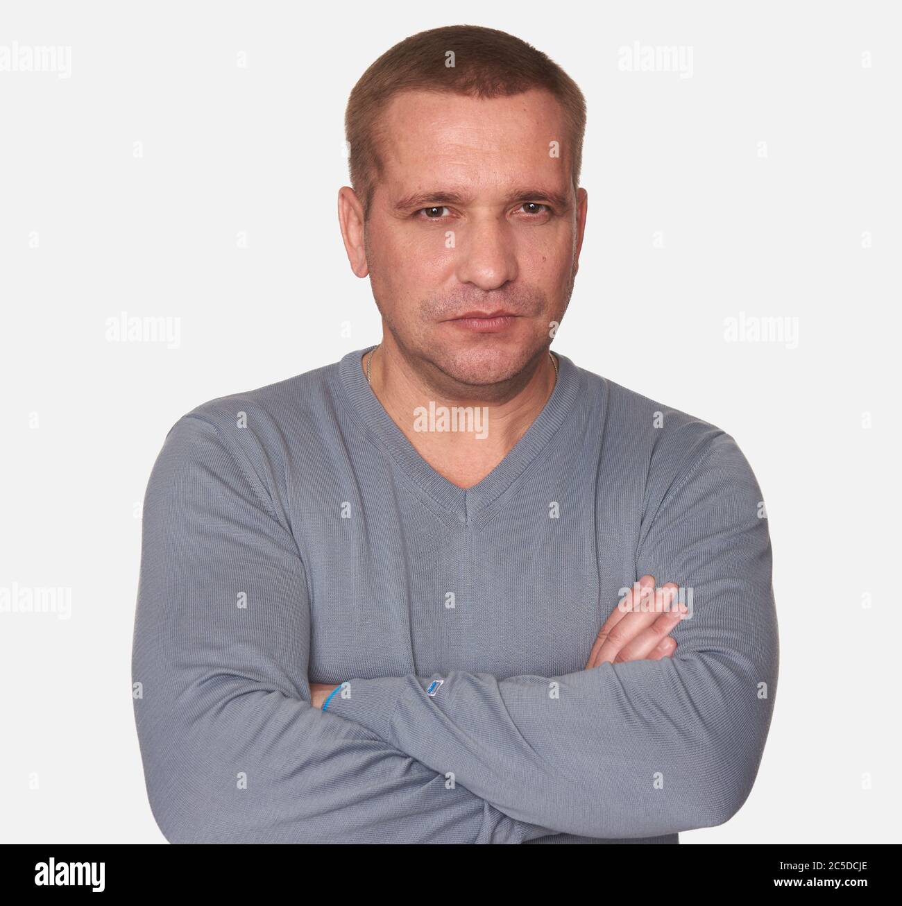 portrait of a serious middle adult man isolated on white background ...