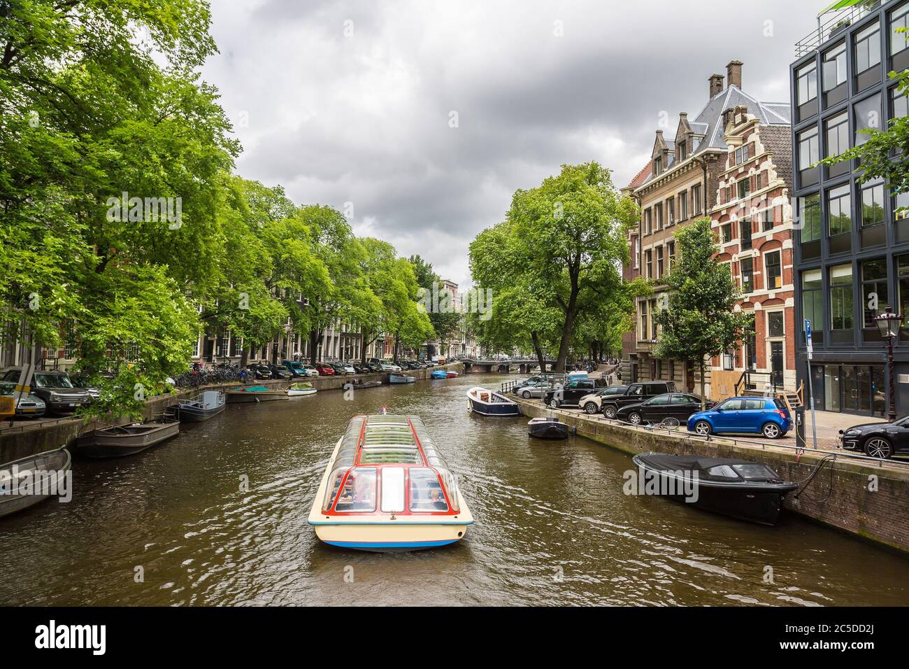 Canal in Amsterdam in a beautiful summer day. Amsterdam is the capital and the most populous ...