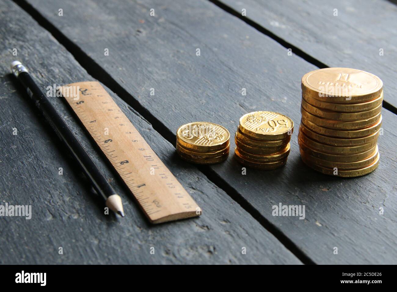 Graph of profit growth from gold coins. Vintage style Stock Photo - Alamy