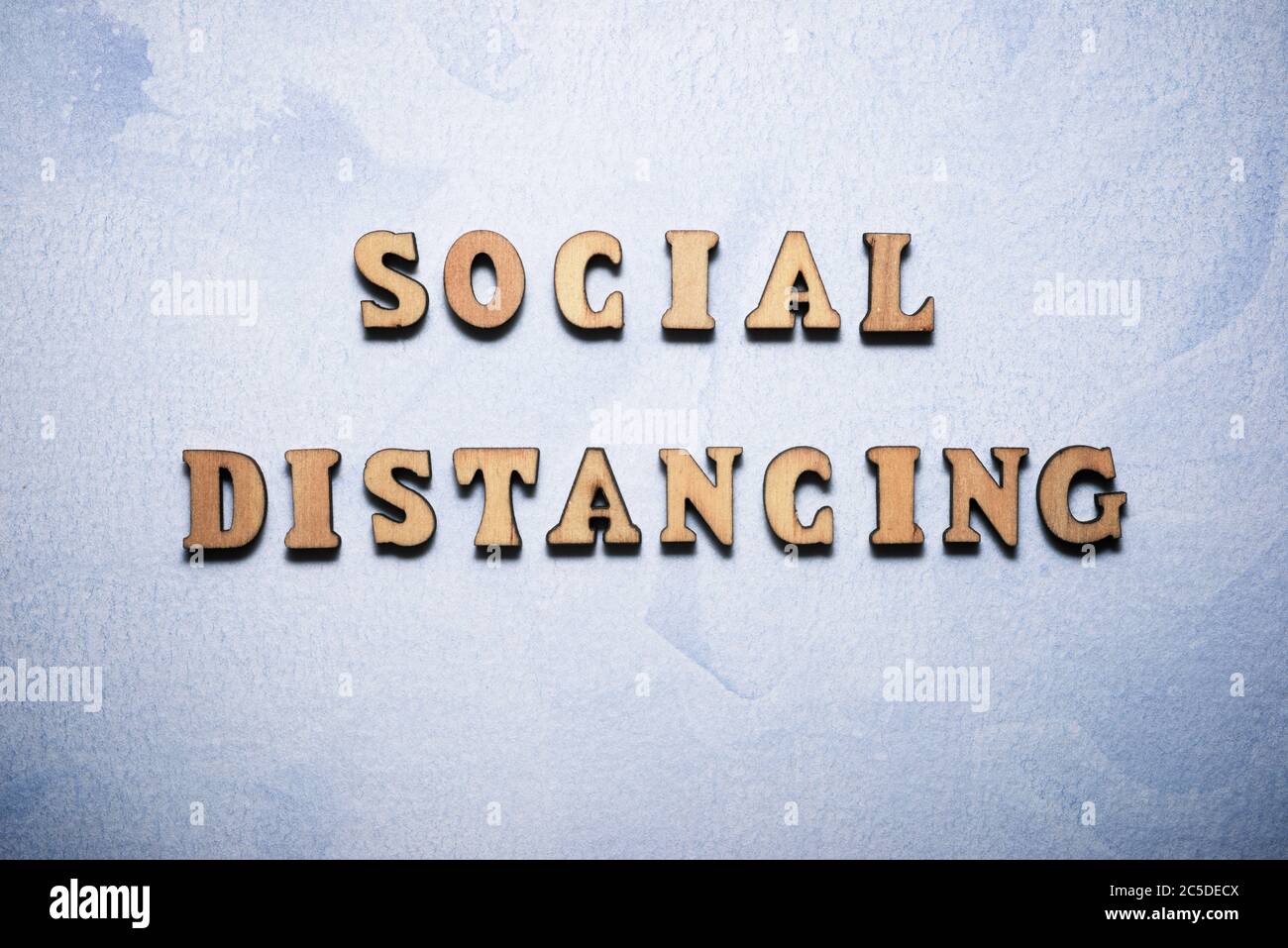 Social distancing text in a colored paper Stock Photo - Alamy