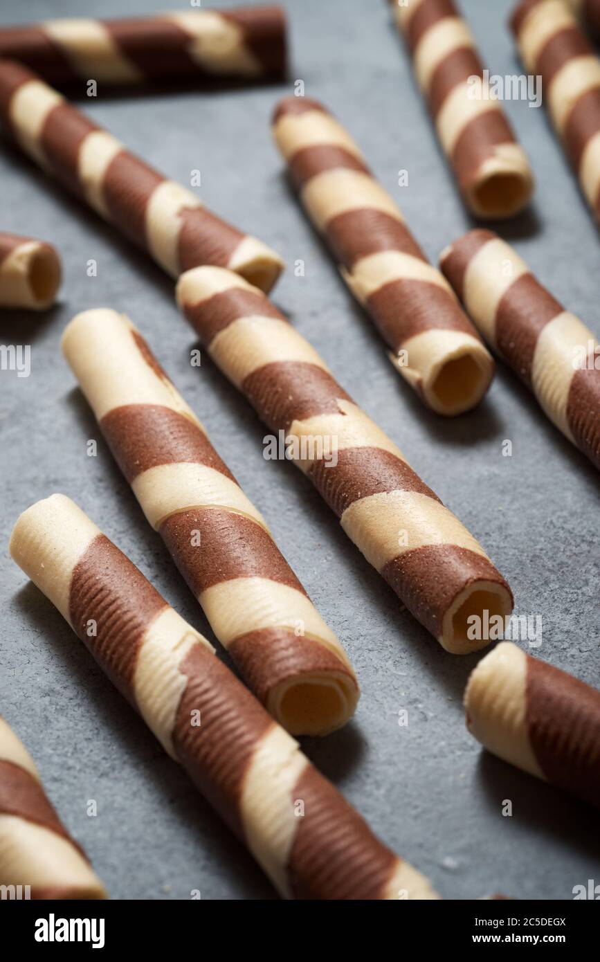 Wafer rolls on a stone table Stock Photo - Alamy