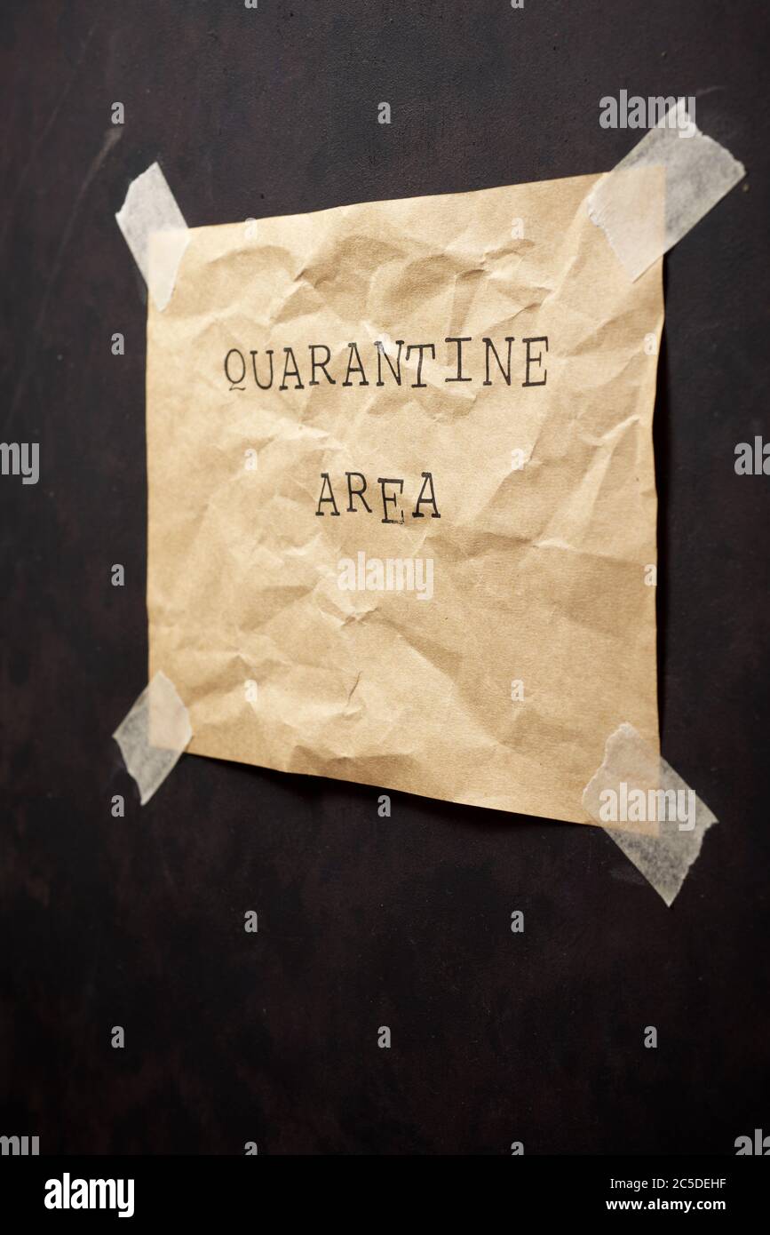 Quarantine area text on a wall Stock Photo - Alamy