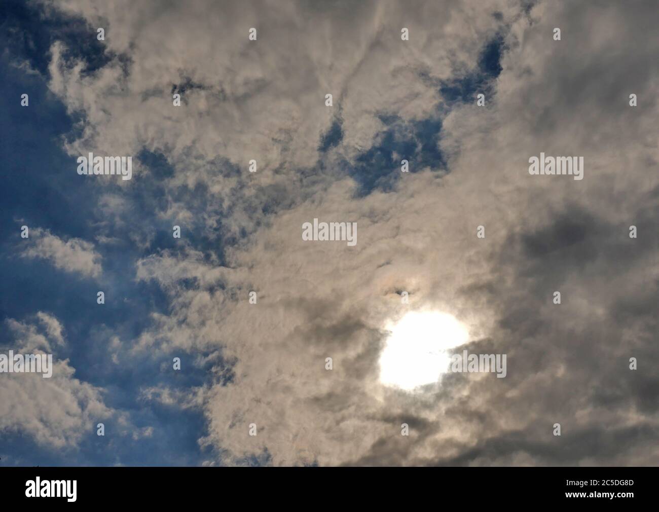 clouds blue sky sun light ray beam Stock Photo - Alamy