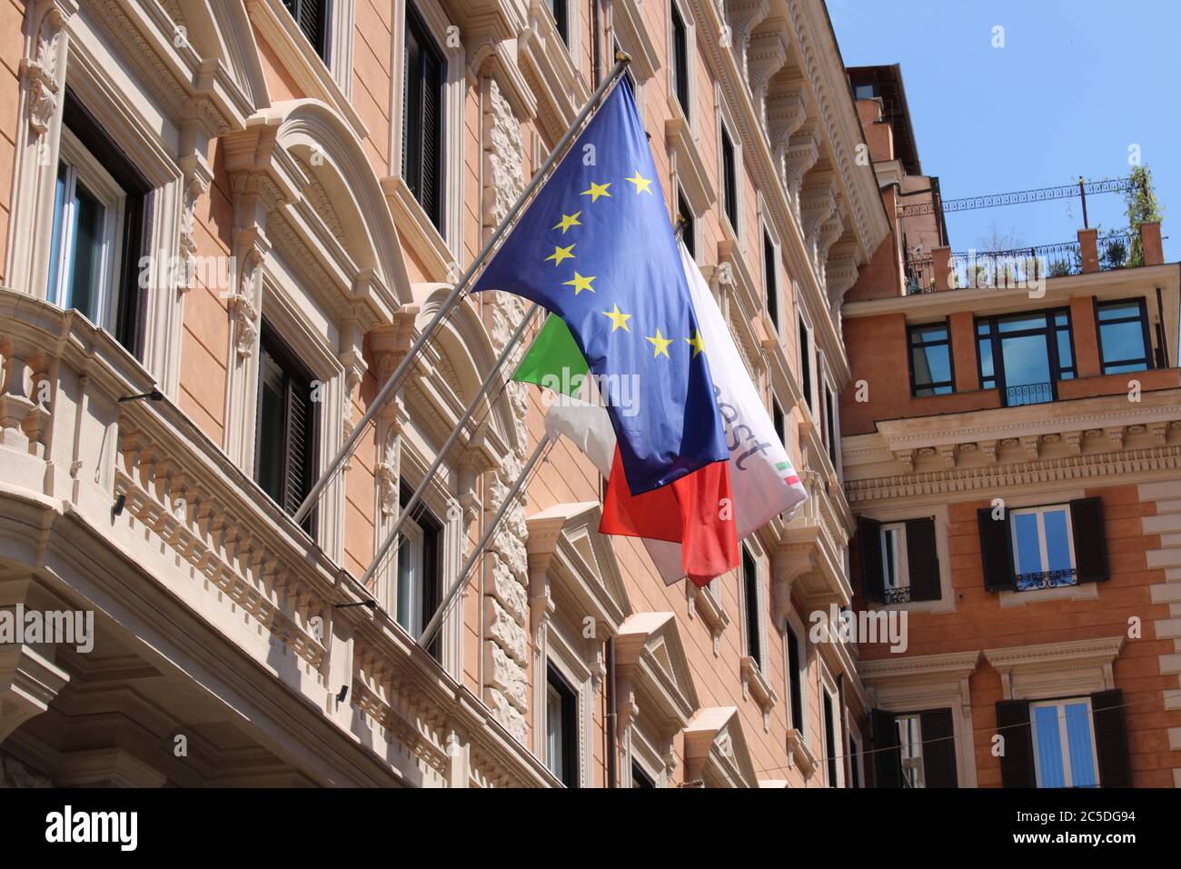italian flag and european union flags on a buildings in rome city ...