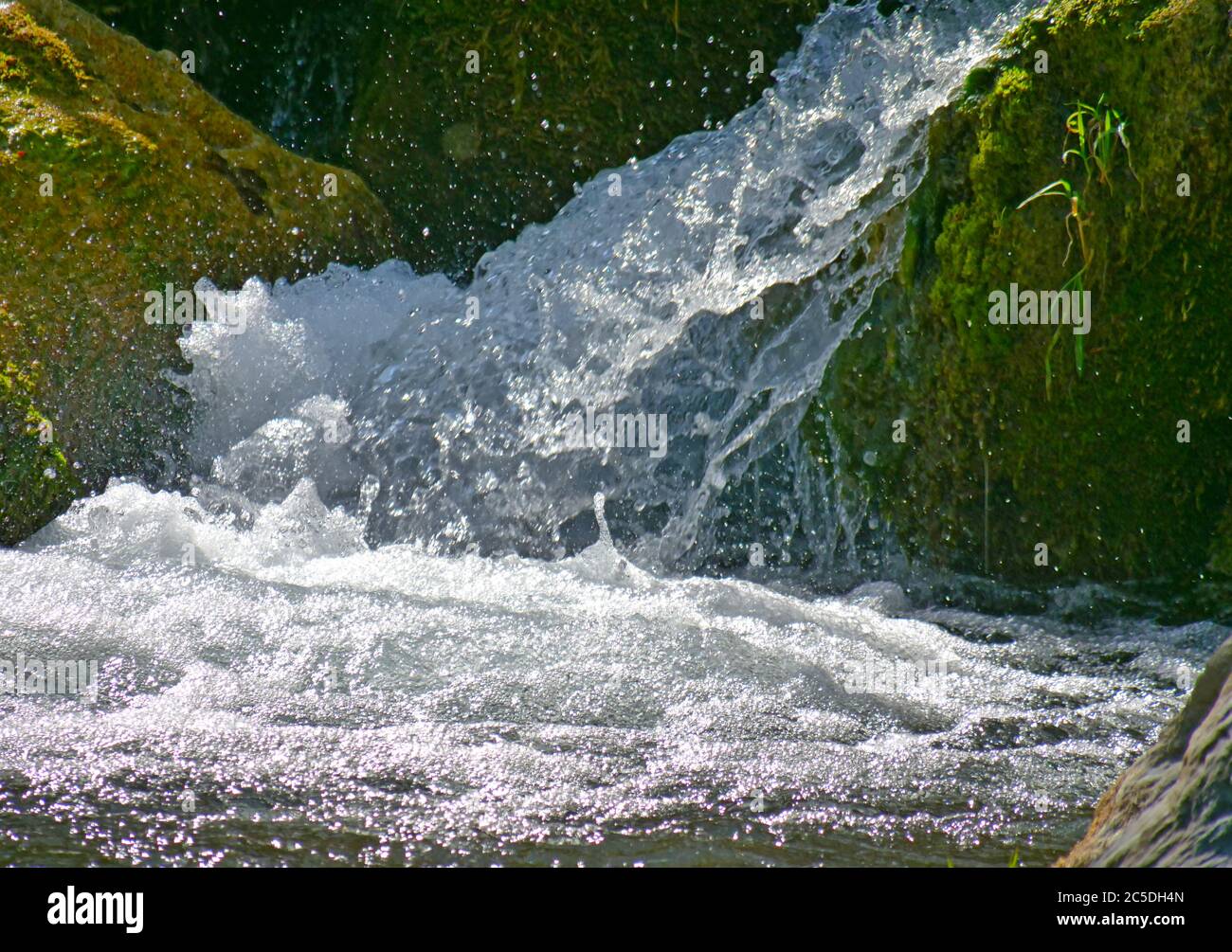 small mountain waterfall in natural, pure water Stock Photo - Alamy