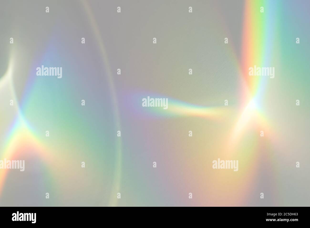 Blurred rainbow light refraction texture on white wall Stock Photo - Alamy