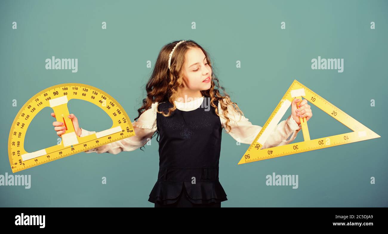 Pupil girl with big rulers. School student learning geometry. small ...
