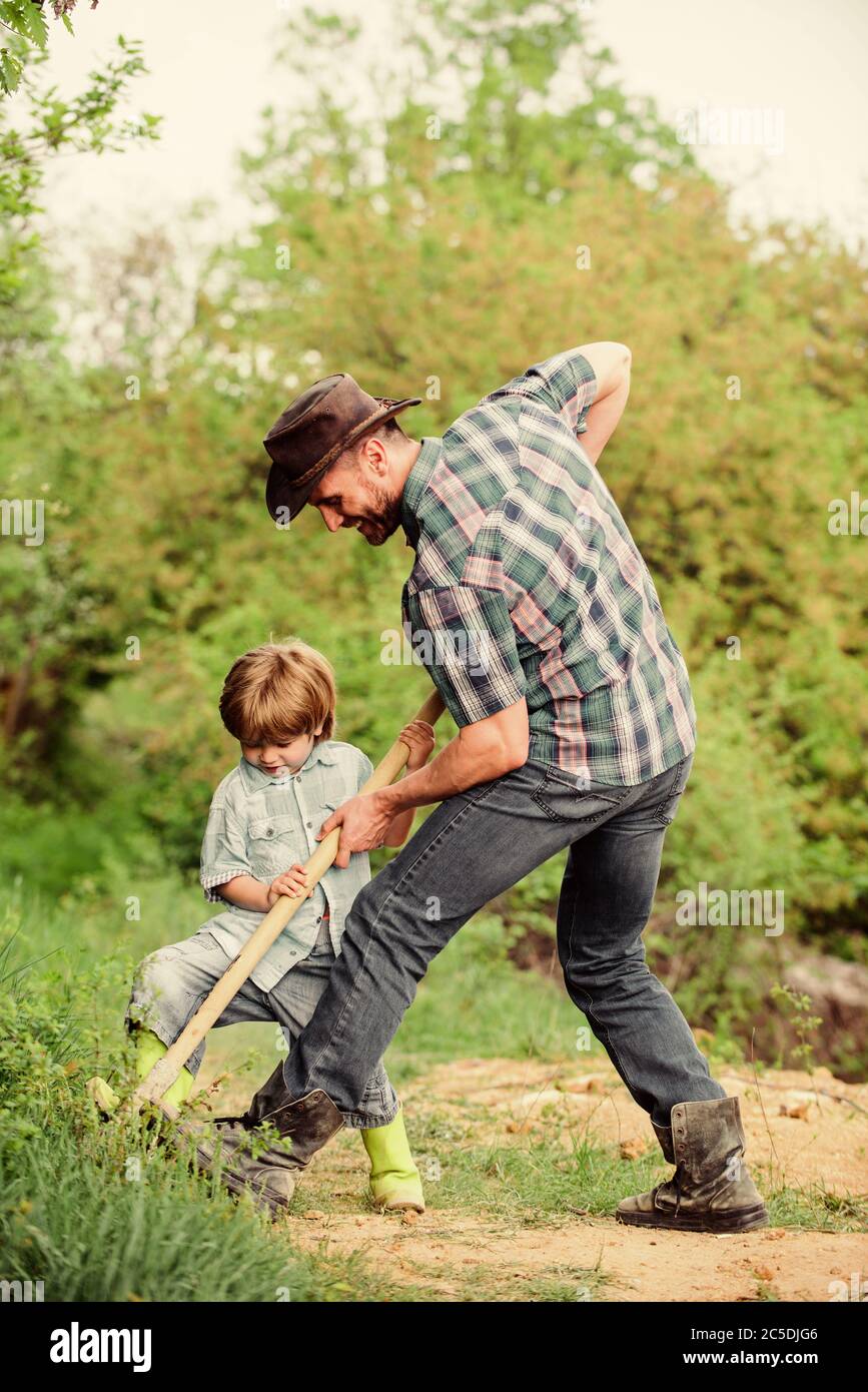Find treasures. Little boy and father with shovel looking for treasures ...