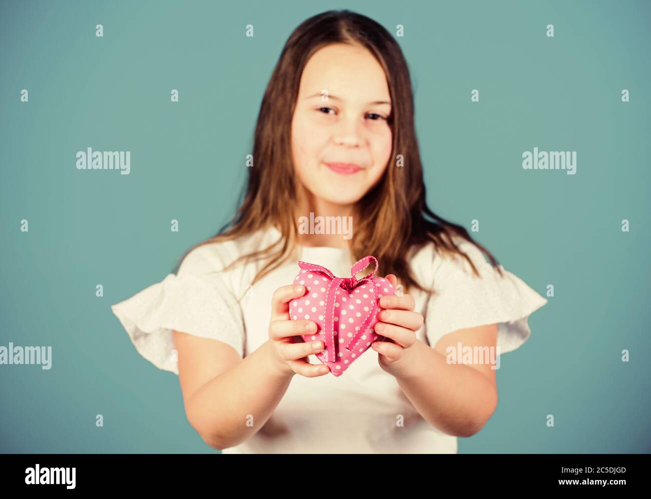 Girl cute child show heart toy. Heart symbol of love. Kid adorable girl ...