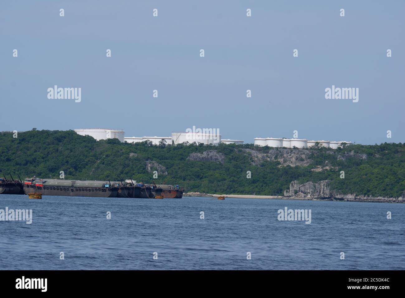 Crude oil storage tank on the island in the sea Stock Photo - Alamy