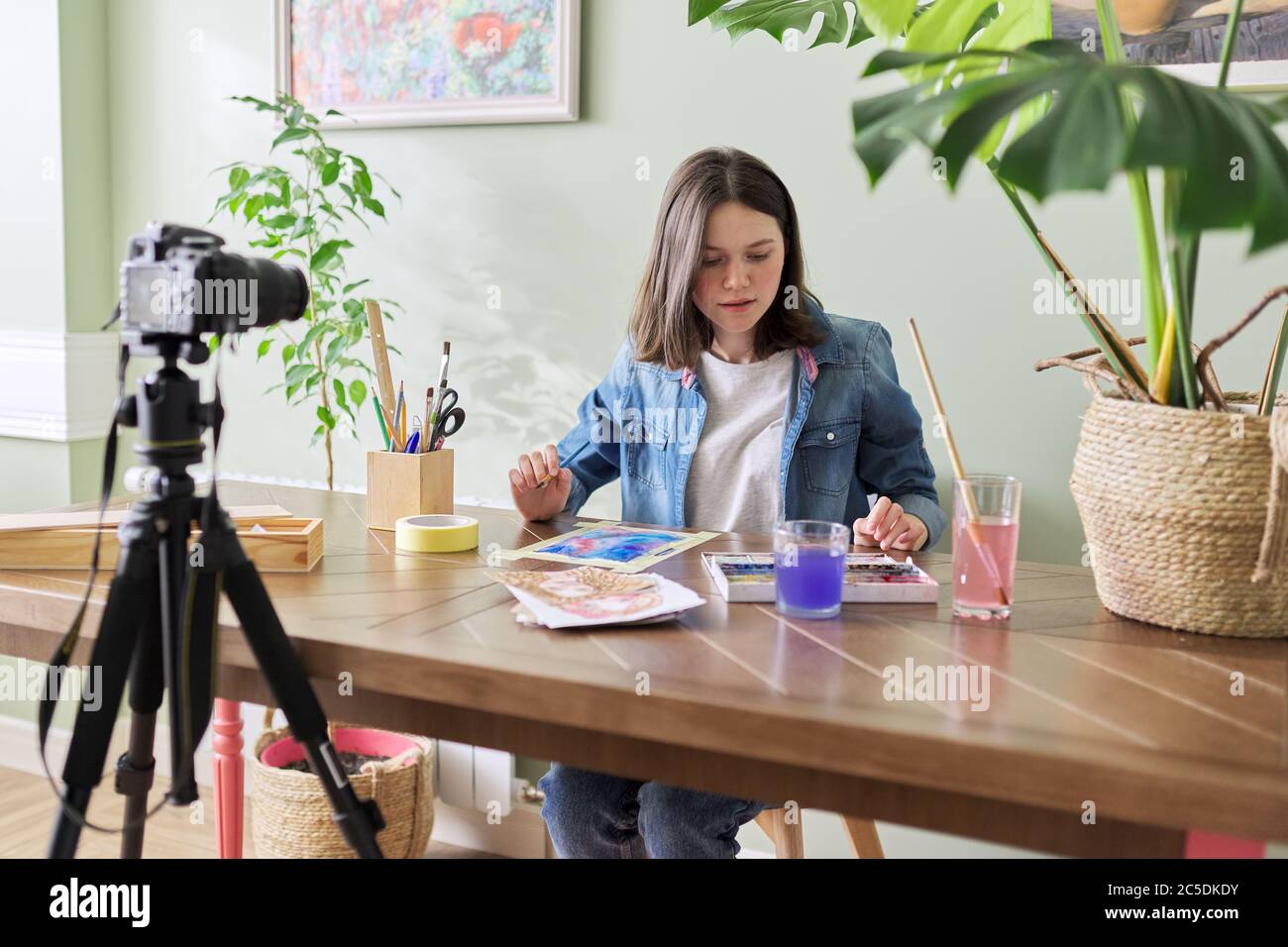 Creative girl teenager artist painting in watercolor Stock Photo - Alamy