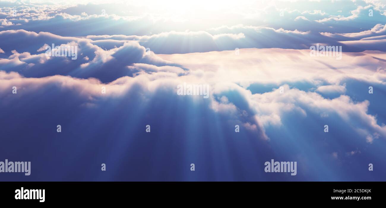fly above clouds sunset god ray light Stock Photo - Alamy