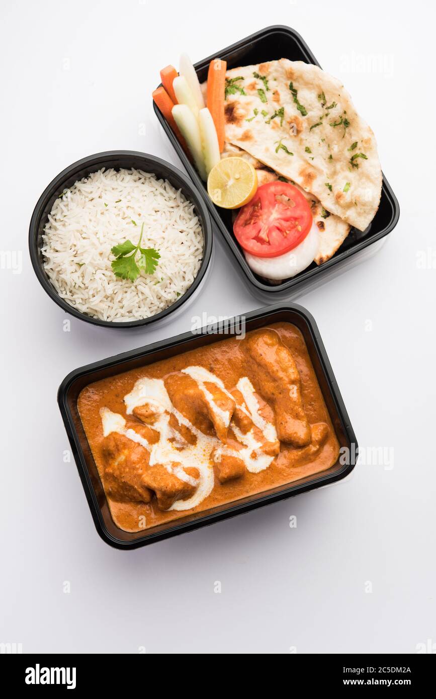 Indian butter chicken curry dish served in black plastic container for ...