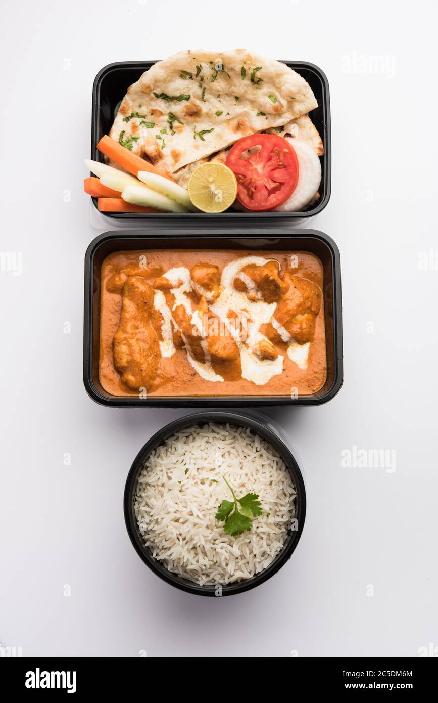 Indian butter chicken curry dish served in black plastic container for ...