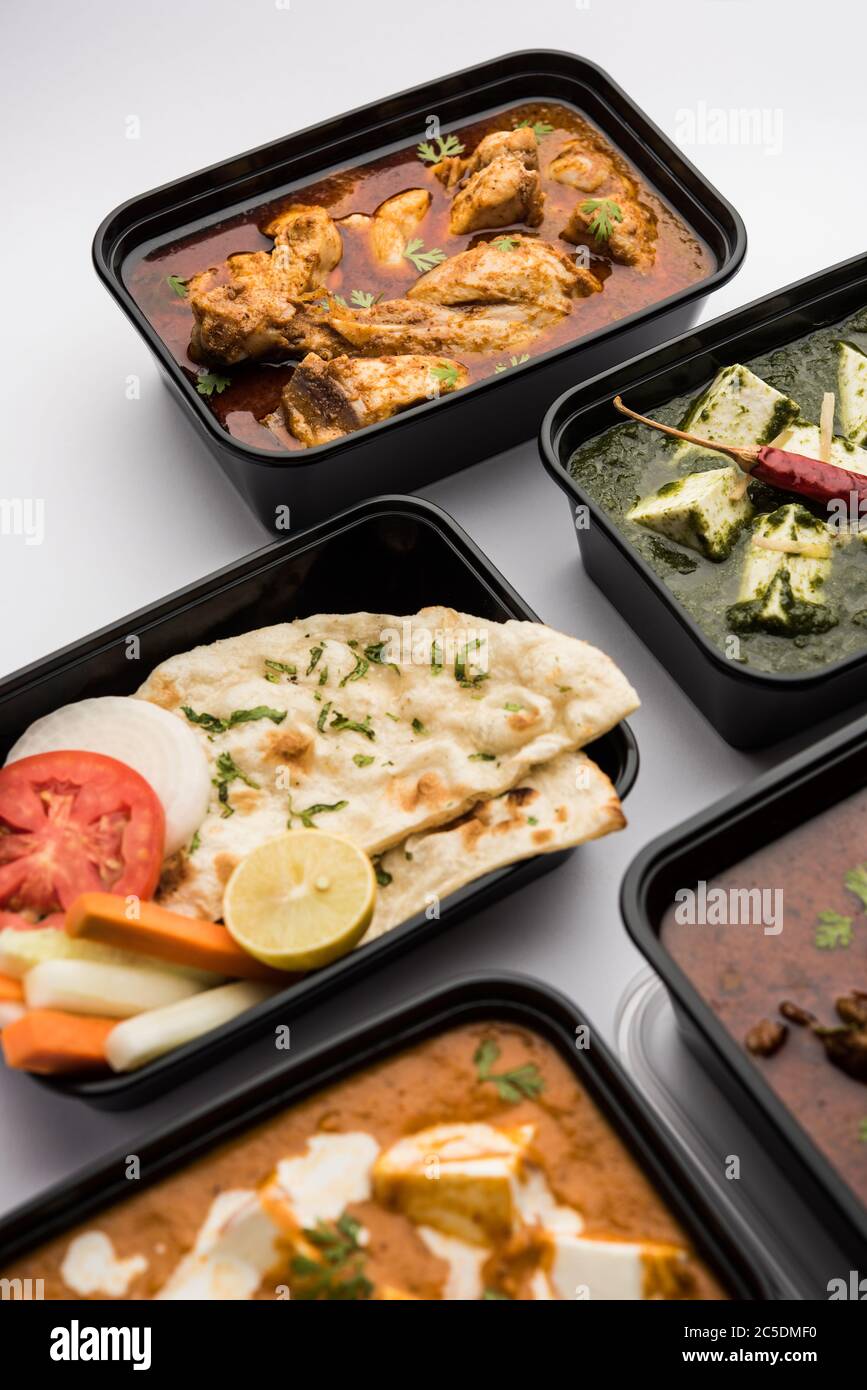 Online Food delivery concept Indian paneer butter masala and palak ...