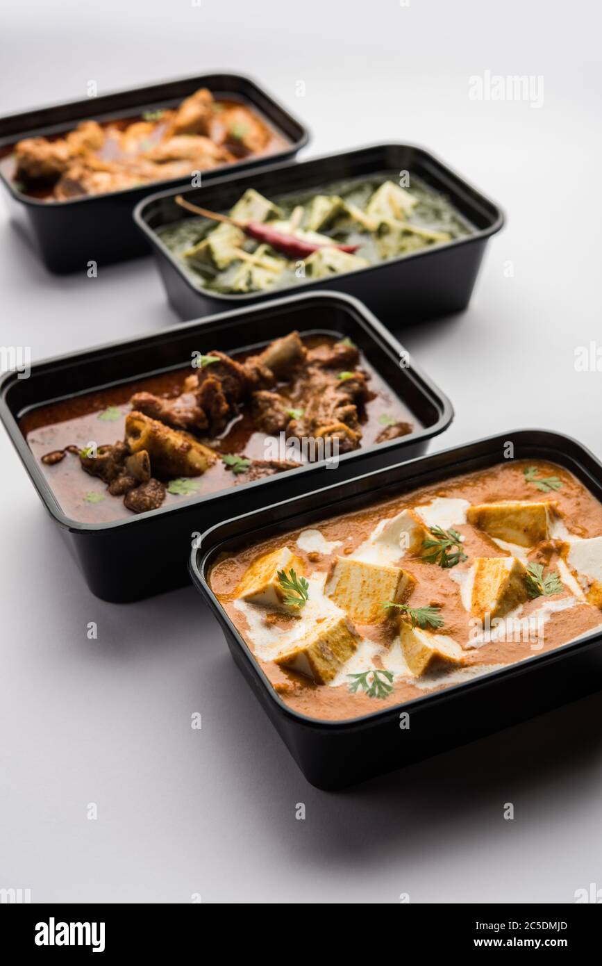 Online Food delivery concept Indian paneer butter masala and palak ...