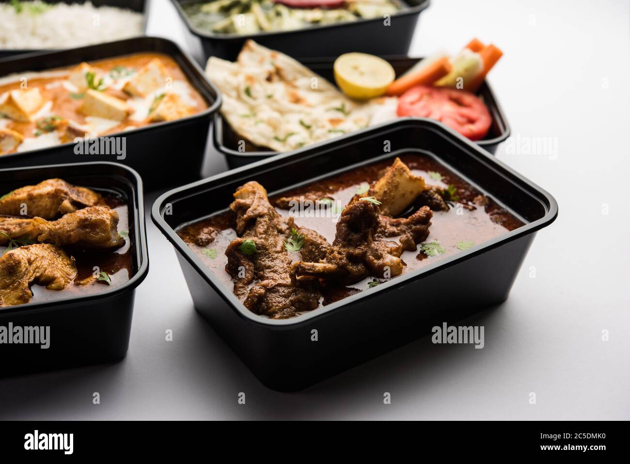 Online Food delivery concept Indian paneer butter masala and palak ...