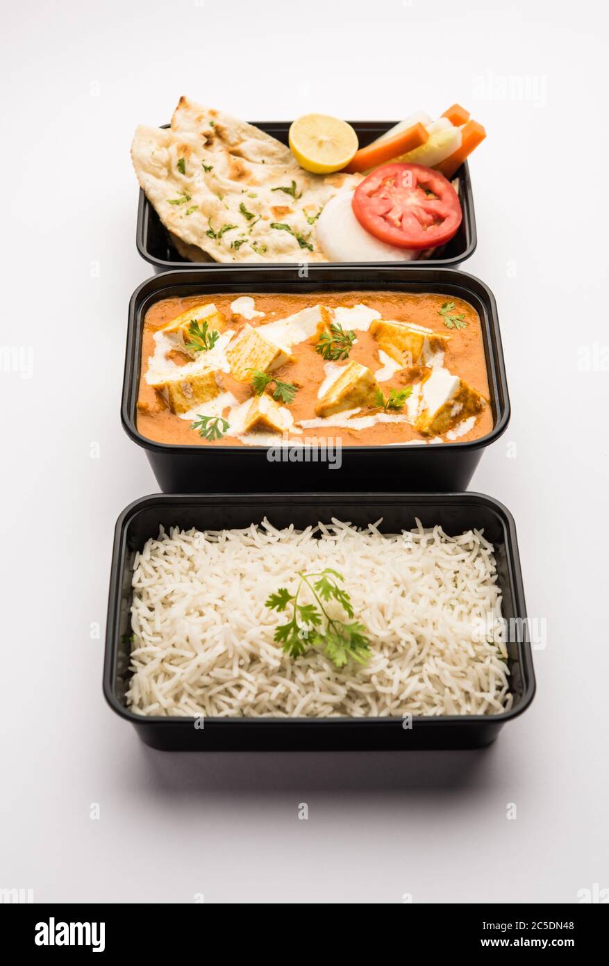 Paneer Butter Masala packed in plastic container or box, ready for home ...