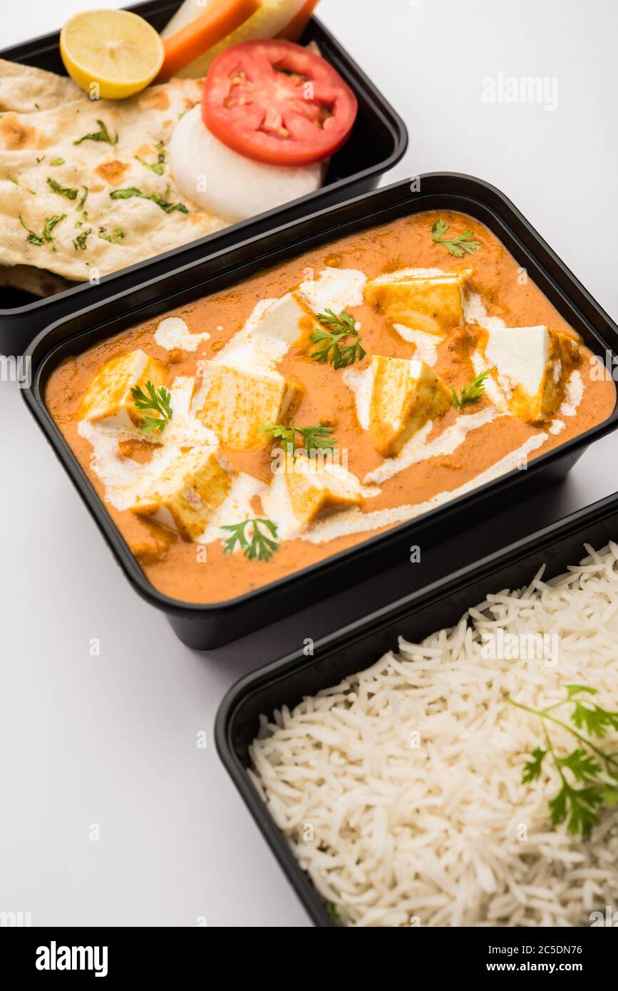Paneer Butter Masala packed in plastic container or box, ready for home ...