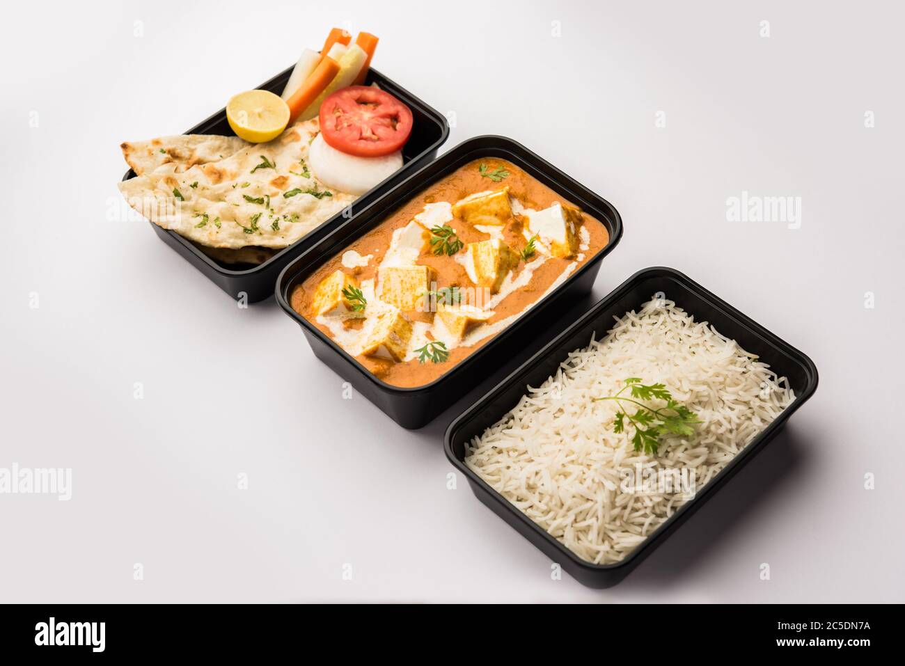 Paneer Butter Masala packed in plastic container or box, ready for home ...