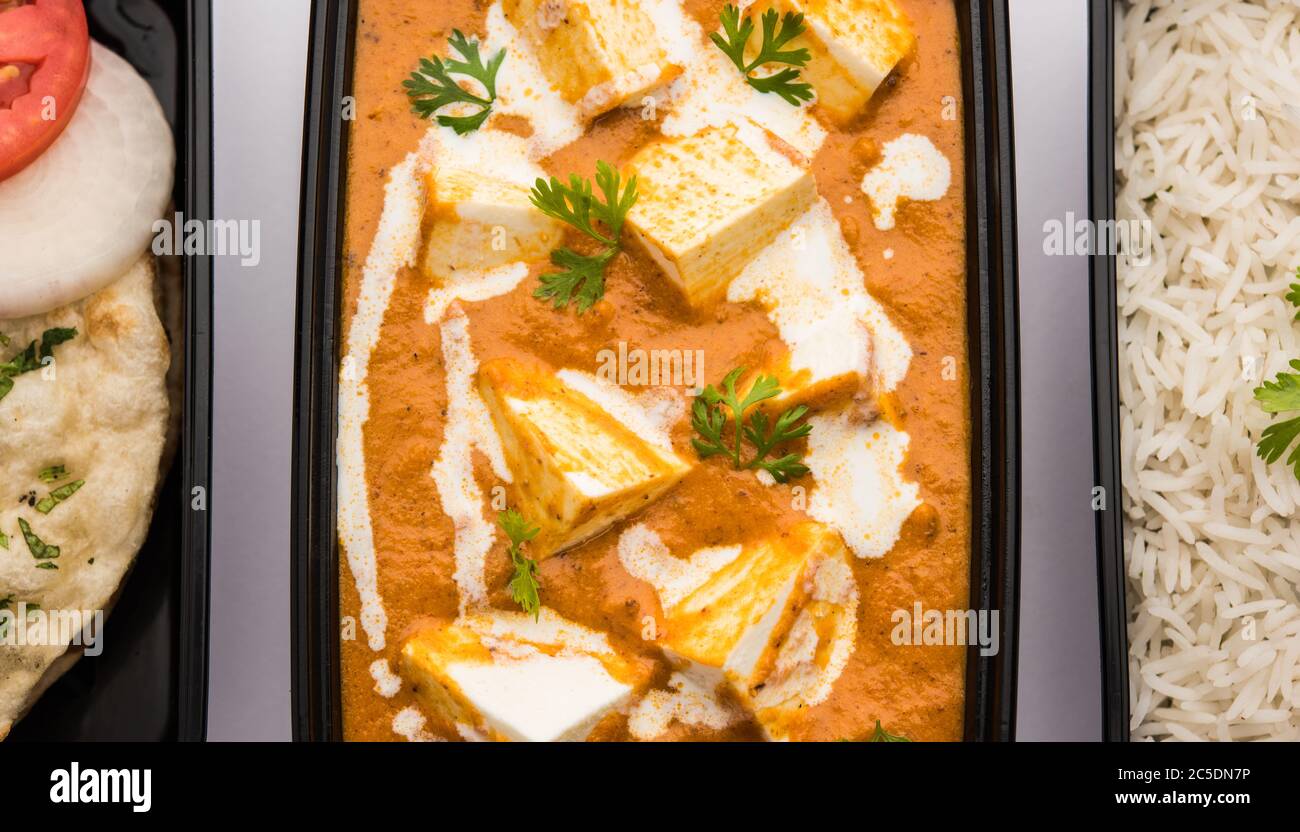 Paneer Butter Masala packed in plastic container or box, ready for home ...
