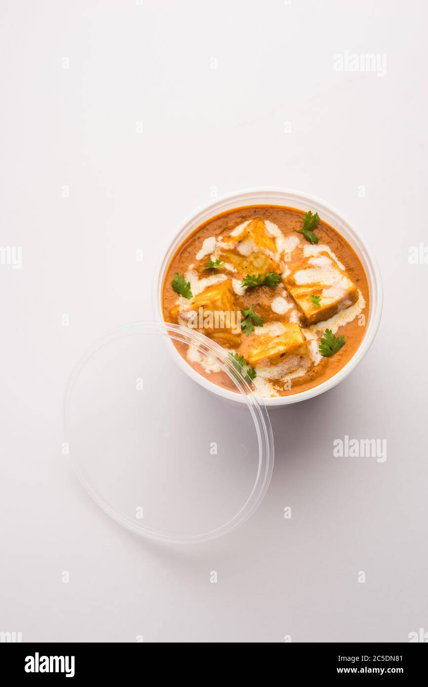 Paneer Butter Masala packed in plastic container or box, ready for home ...