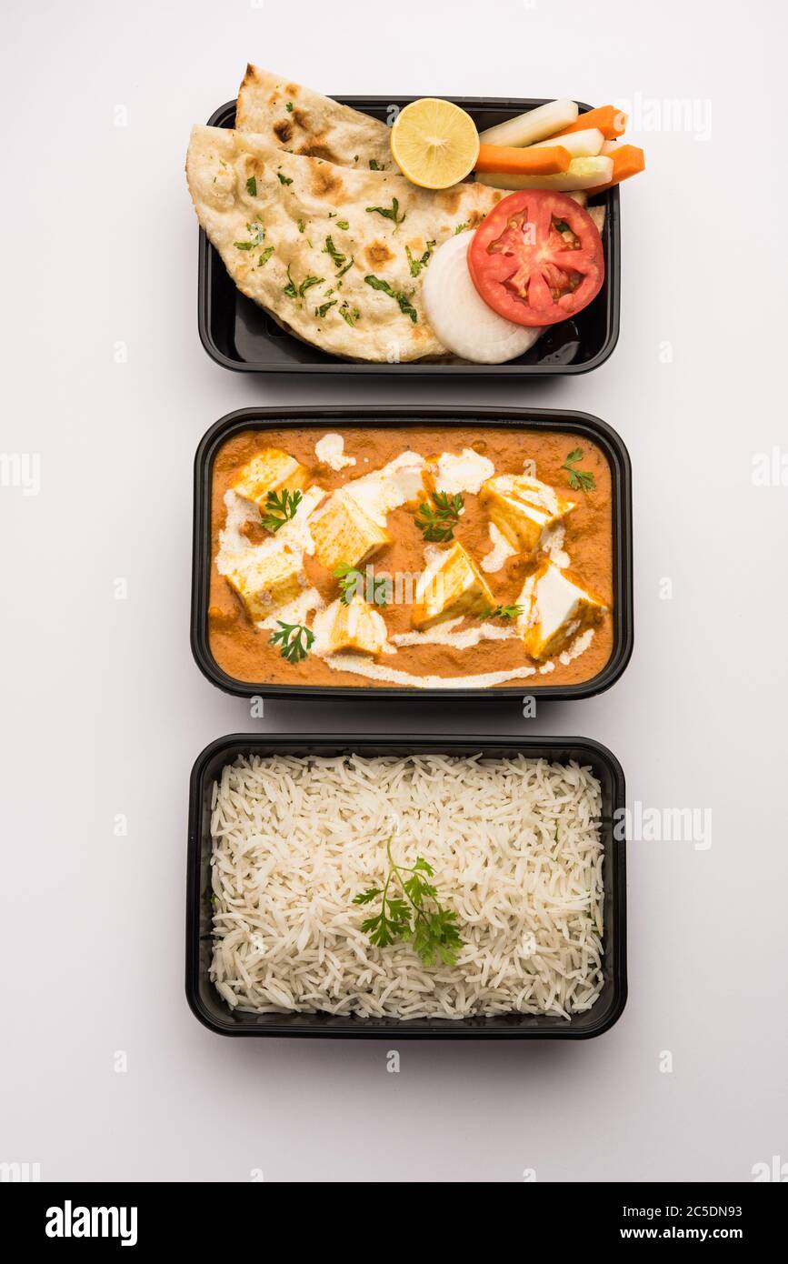 Paneer Butter Masala packed in plastic container or box, ready for home ...