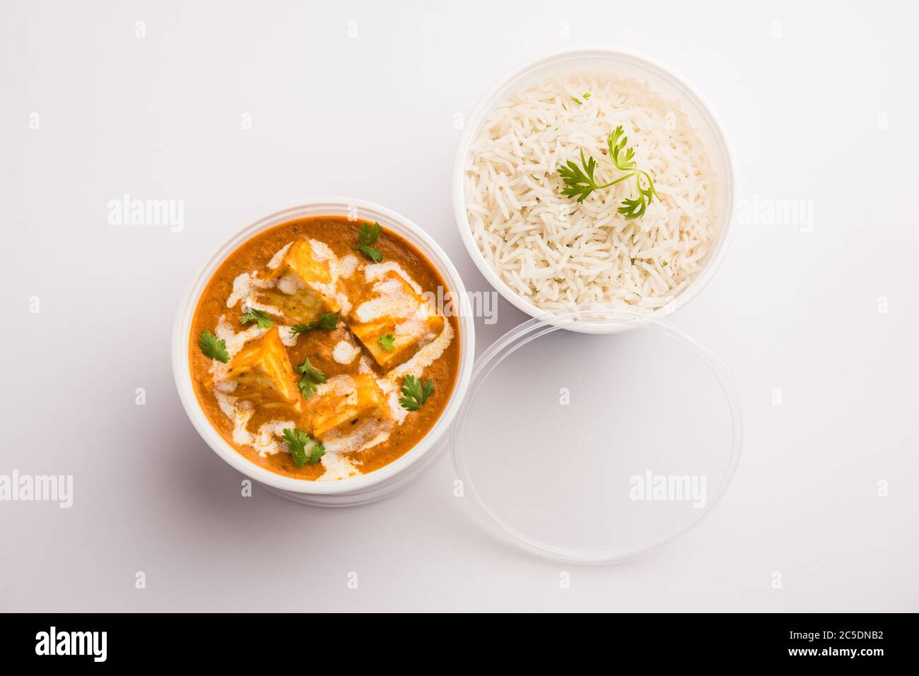 Paneer Butter Masala packed in plastic container or box, ready for home ...