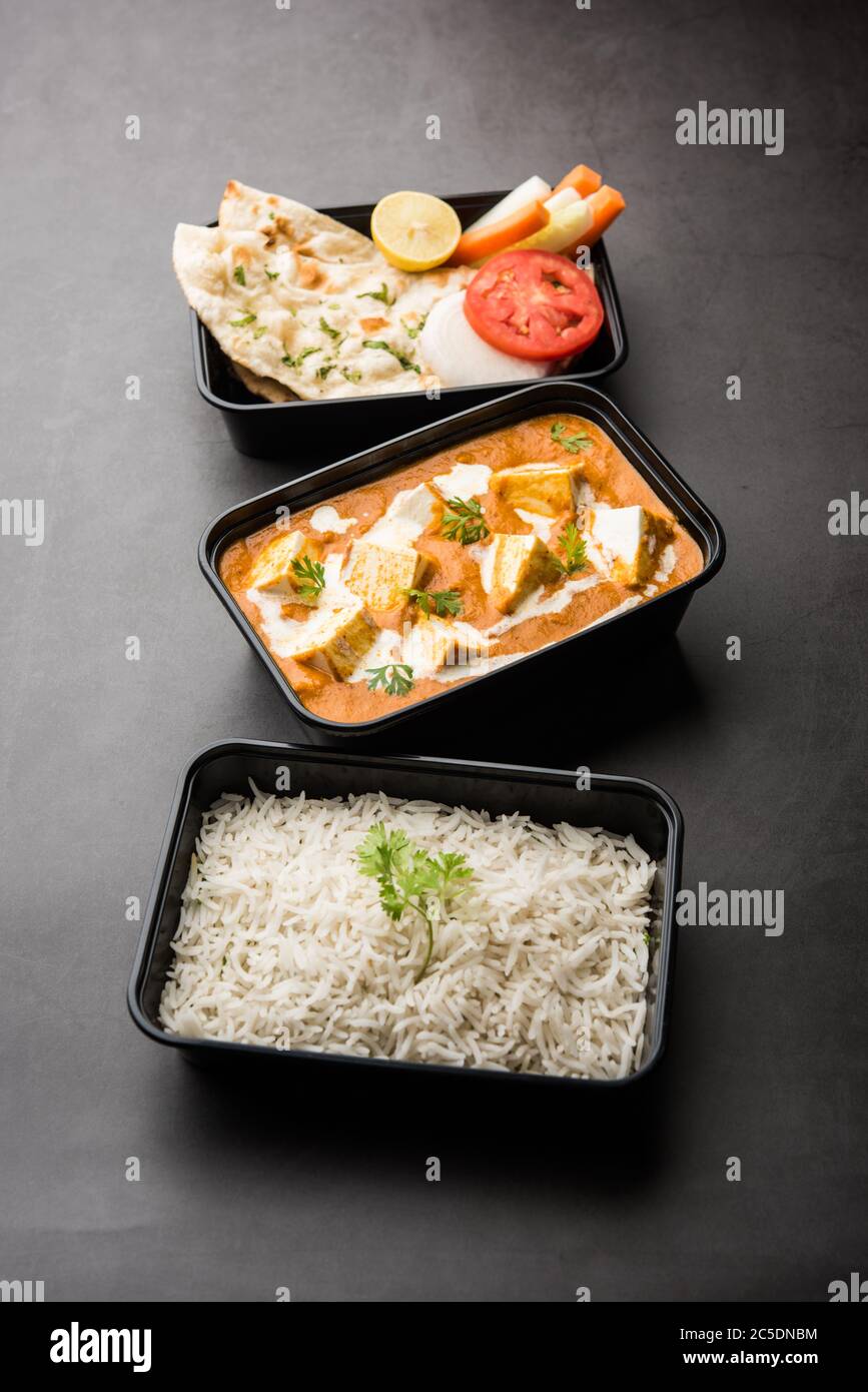 Paneer Butter Masala packed in plastic container or box, ready for home ...
