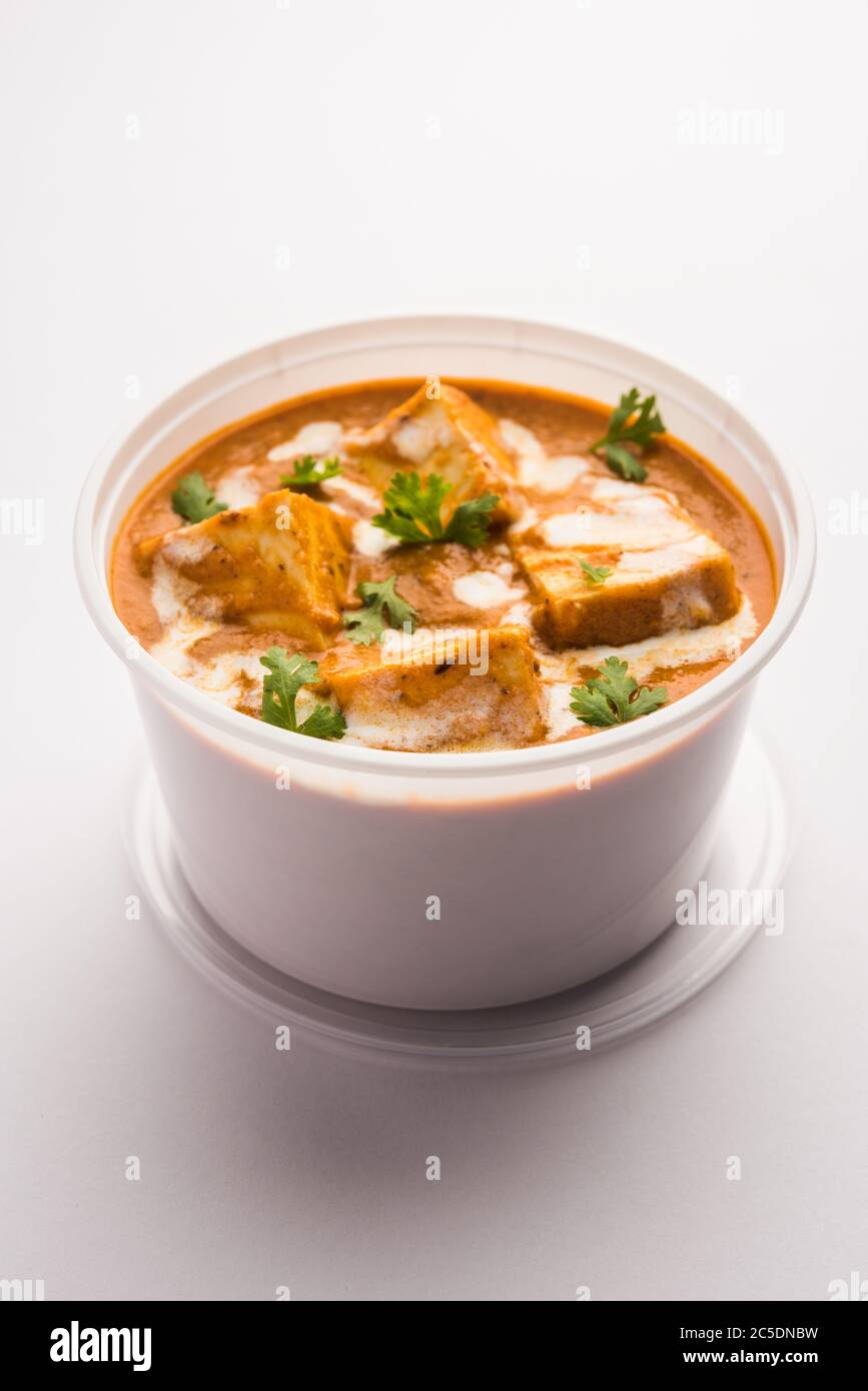 Paneer Butter Masala packed in plastic container or box, ready for home ...