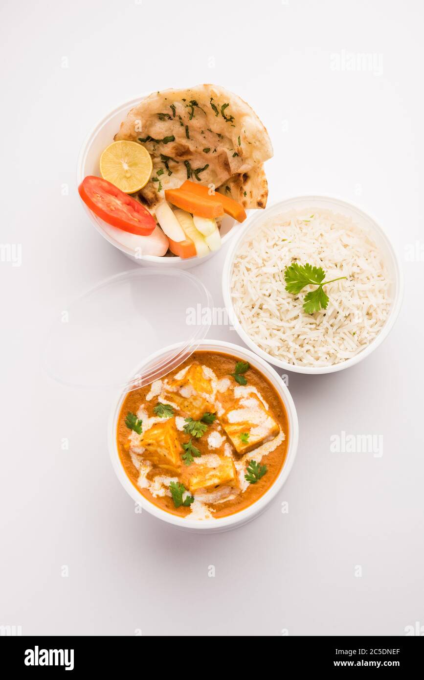 Paneer Butter Masala packed in plastic container or box, ready for home ...