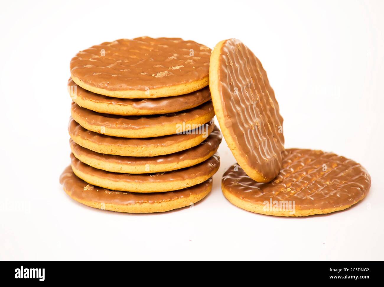 Milk chocolate digestives on a white background Stock Photo - Alamy