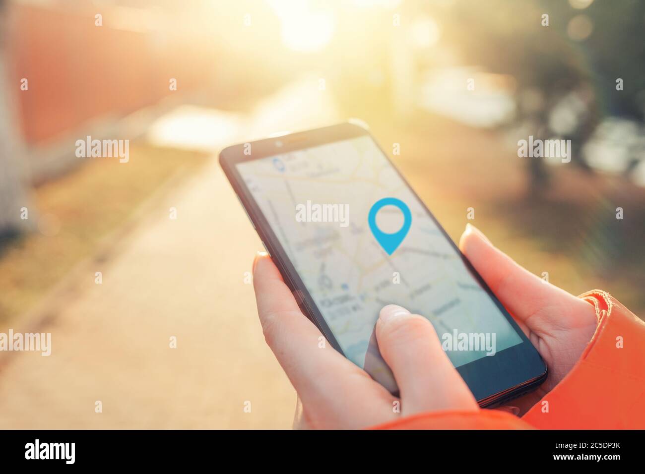 Concept of Internet maps and navigation. Women's hands hold a ...