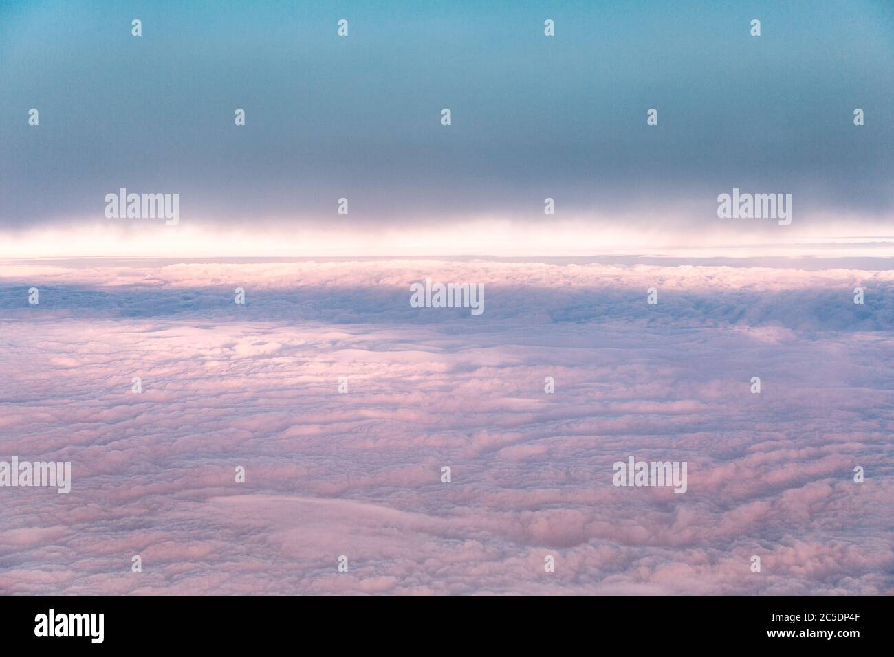 Blue sky background with pink homogeneous clouds Stock Photo - Alamy