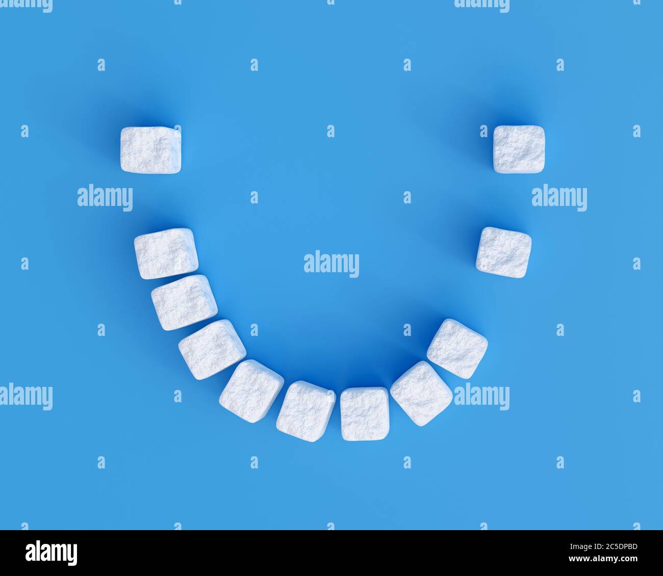 Teeth made of sugar cubes on blue background, some teeth missing. Sweet ...