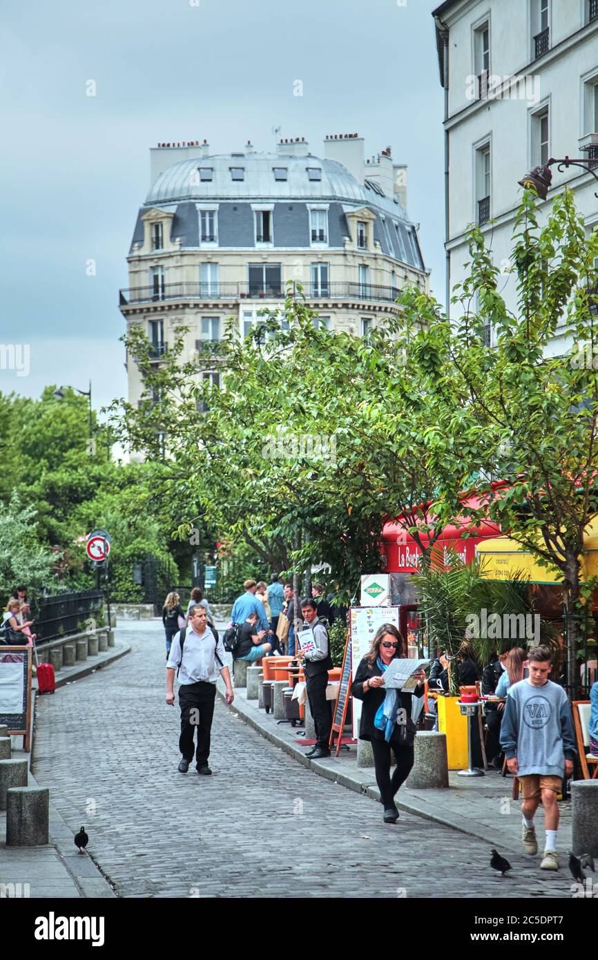 Paris, France - June 18, 2015: pedestrians walking on the pavement ...