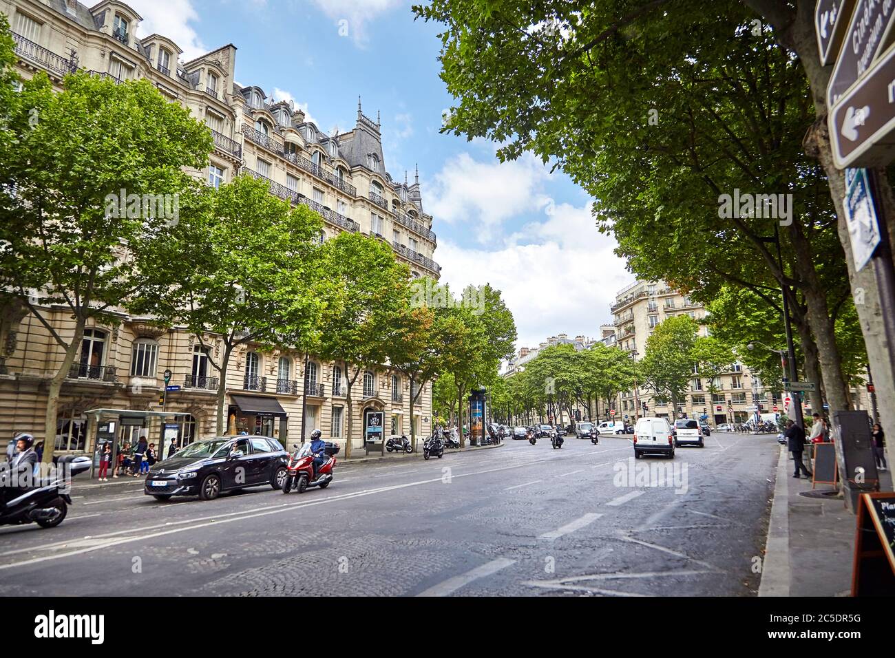 Paris, France - June 19, 2015: Traffic on the beautiful streets of the ...