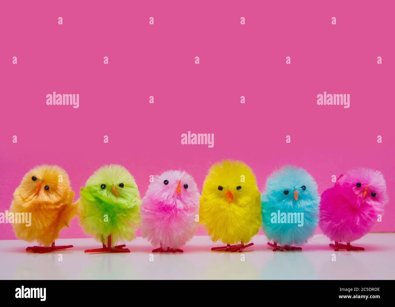 Cute easter chick decorations with a pink background Stock Photo - Alamy