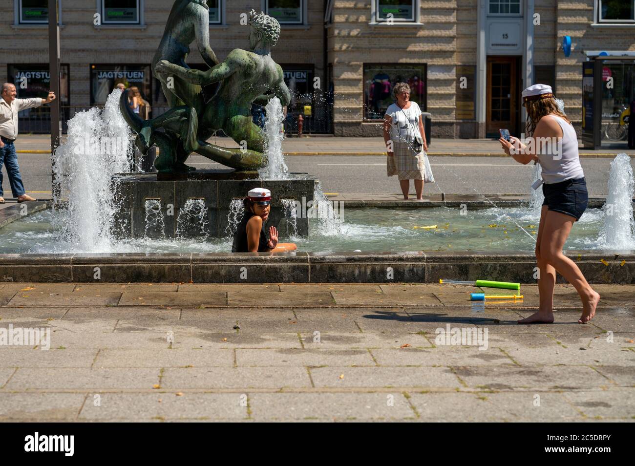 Danish high school student with a cell phone takes a picture of another ...