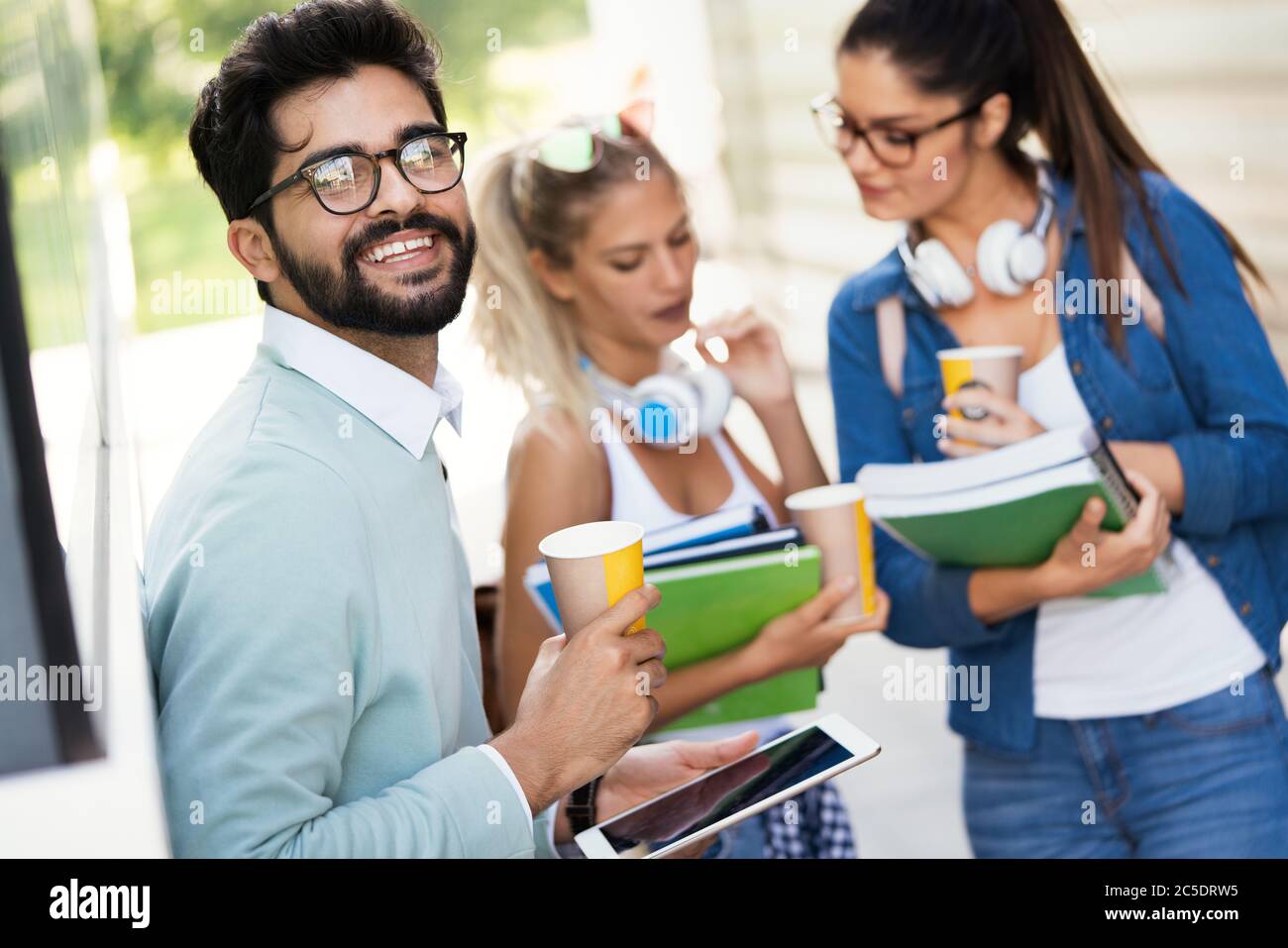 College students studying on university campus outdoor Stock Photo - Alamy