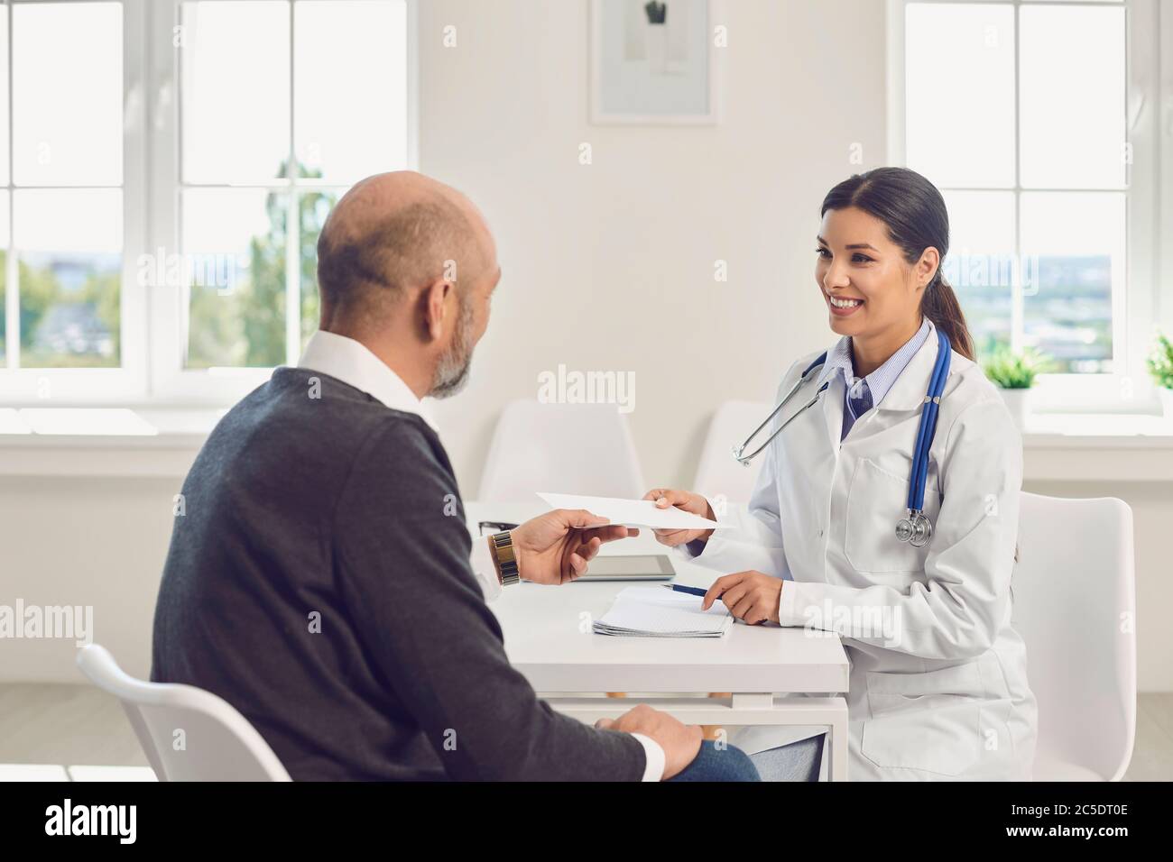 Senior man patient visiting doctor at clinic Stock Photo - Alamy